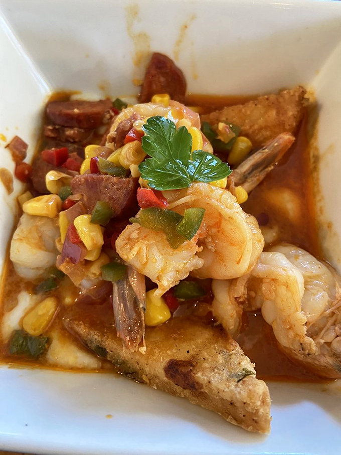 Close-up magic: succulent shrimp nestled against a triangle of grilled cornbread, creating the perfect bite of land and sea.
