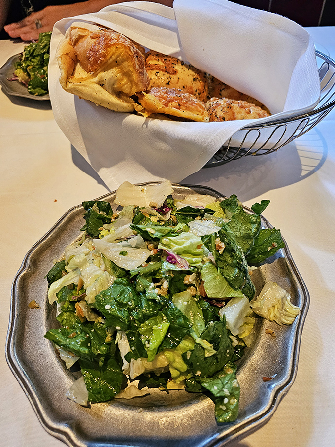 The token vegetable portion of your meal! Crisp greens and house dressing that somehow make you feel virtuous before the meat parade begins.