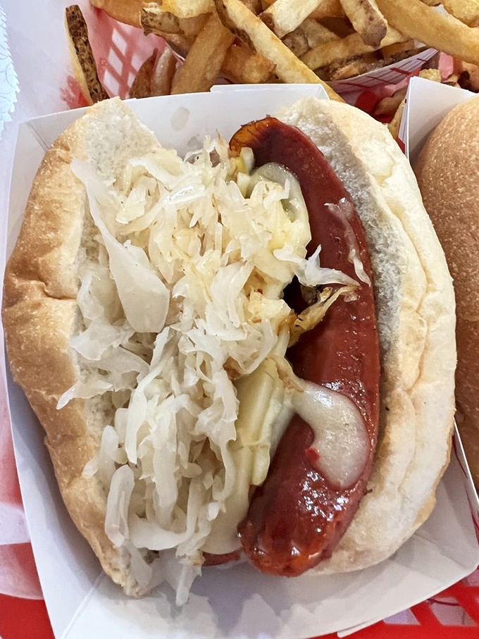 Sauerkraut and mustard piled high on a snappy dog. Some relationships are complicated, but this one makes perfect sense from the first bite.
