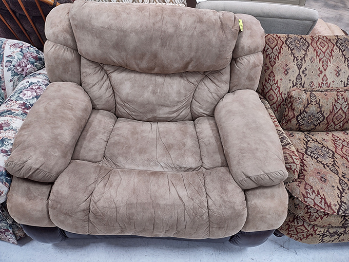 The furniture section's unofficial mascot: a microsuede recliner that's seen enough Netflix binges to write its own series reviews.