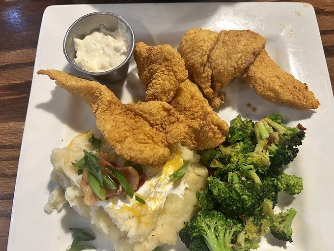 Southern fried catfish with all the fixings&mdash;proof that sometimes the best ocean treasures come served on solid ground.