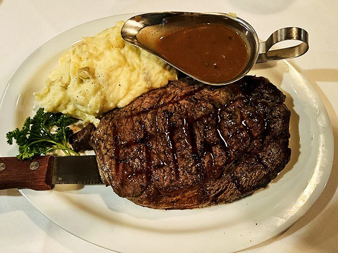The Spencer Steak arrives with a sear that would make Maillard himself weep with joy. That gravy boat isn't decoration&mdash;it's liquid gold.