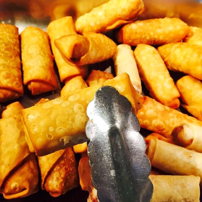 Spring rolls lined up like crispy soldiers, ready to crumble at first bite. Their golden armor protects treasures of savory filling within.