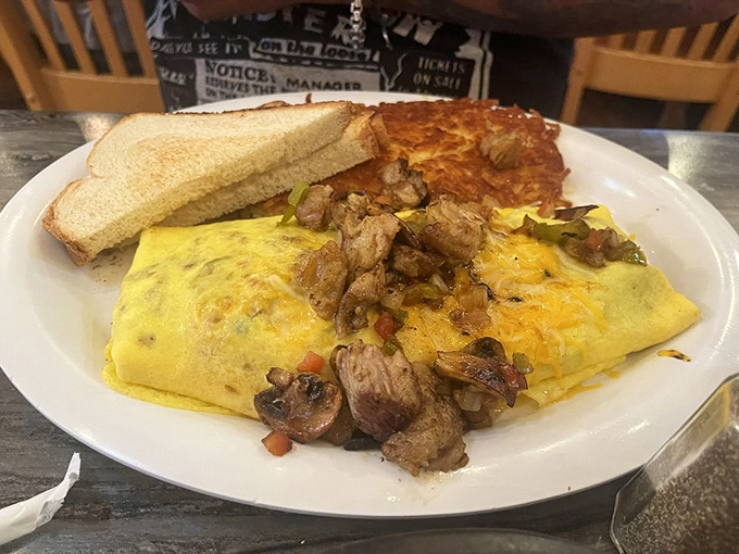 A proper omelet is food origami, and this one's been folded around enough fillings to make Marie Kondo question her minimalist philosophy.
