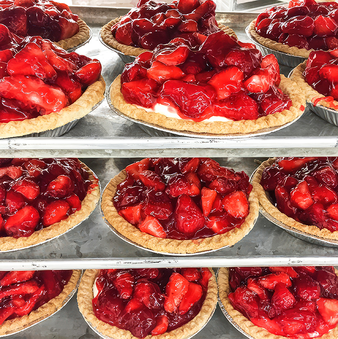 These strawberry pies glisten like rubies in a bakery crown, their perfect balance of sweet-tart filling practically singing through the glaze.