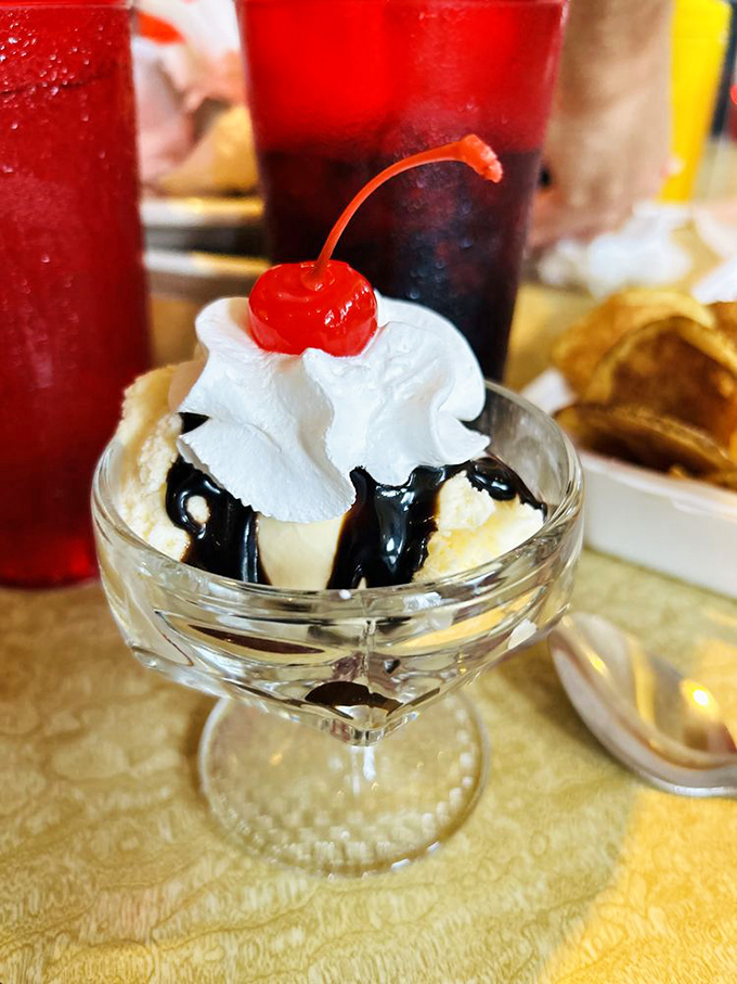 Hot fudge sundae perfection&mdash;where vanilla ice cream stands as the Switzerland between hot chocolate lava and that ceremonial cherry on top.