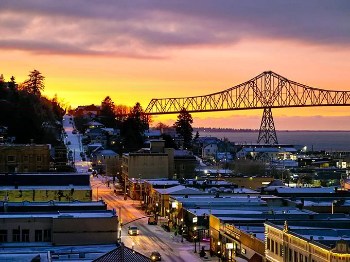 Sunset View: As day turns to dusk, Astoria's downtown lights twinkle beneath a technicolor sky, with the bridge silhouetted like a steel rainbow.