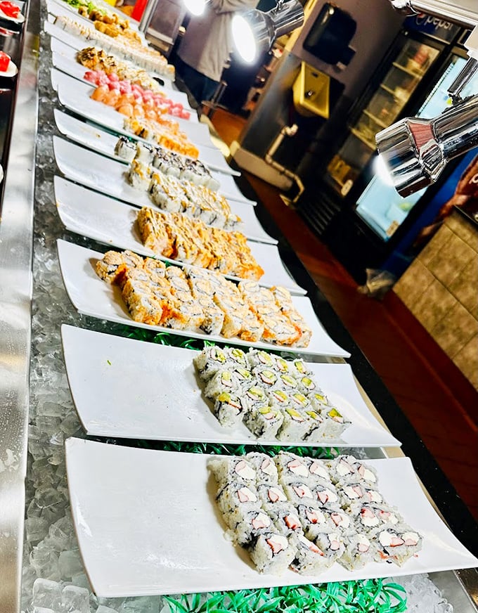 The sushi lineup stretches toward the horizon, each colorful roll standing at attention like delicious soldiers awaiting your selection.