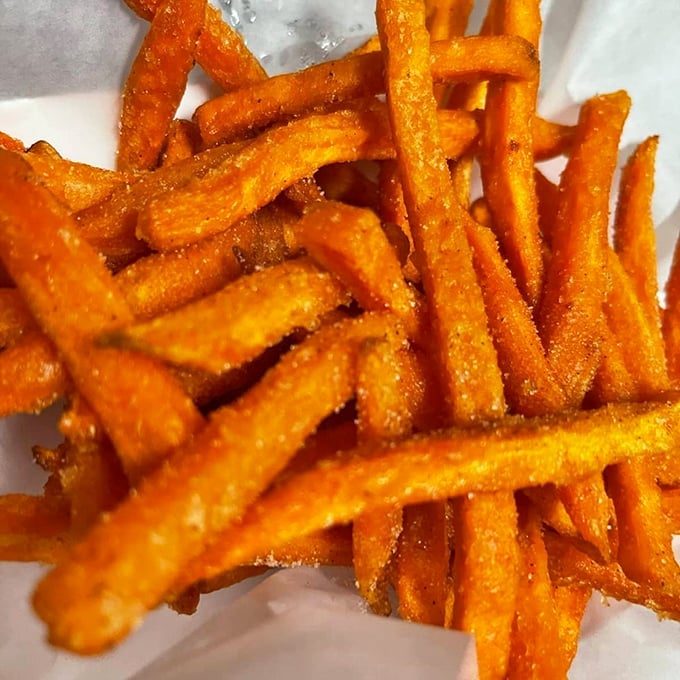 Sweet potato fries with that perfect orange glow&mdash;like edible autumn sunshine that somehow improves everything they touch.