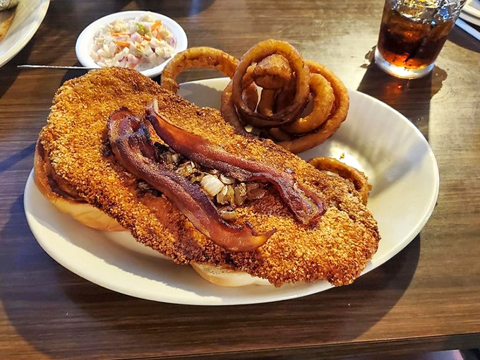 This cornmeal-crusted catfish topped with bacon strips isn't trying to be fashionable &ndash; it's too busy being delicious.