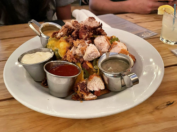 "The Pile" lives up to its name &ndash; a mountain of crispy fried chicken atop something delicious, surrounded by dipping sauces like courtiers around a king.
