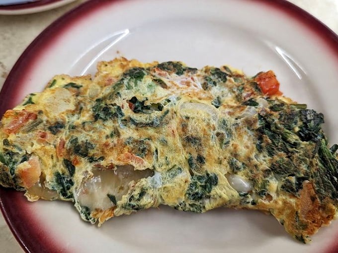 This veggie omelet doesn't need a fancy farm-to-table pedigree to impress&mdash;just fresh ingredients folded into fluffy eggs by hands that know what they're doing.