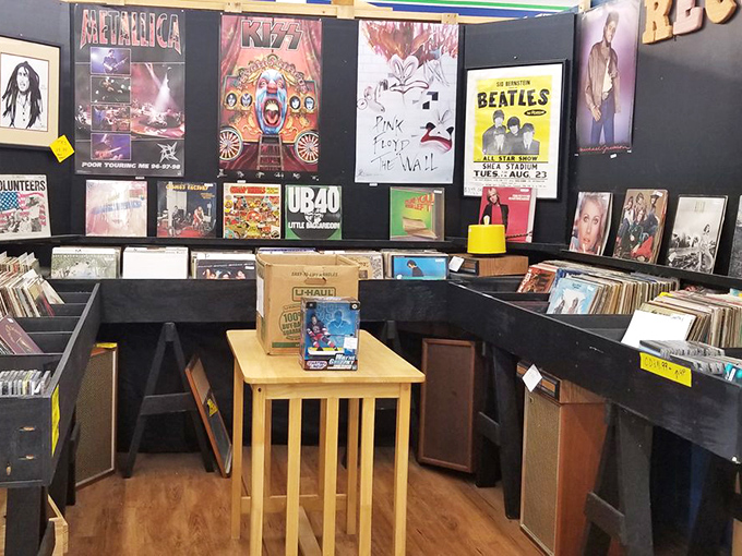 Rock history lines these walls like a physical Spotify playlist. Metallica to The Beatles, all without needing to remember your password.