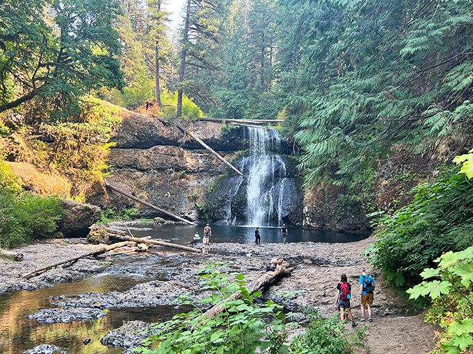 Nature's ultimate splash zone where hikers gather to witness Lower South Falls in all its glory. That cooling mist is worth every step.