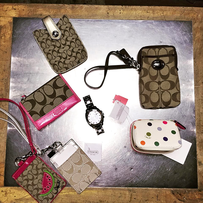 Designer wallet wonderland! Like finding money inside something you buy to hold money&mdash;the cosmic poetry of thrift store accessories at their finest.