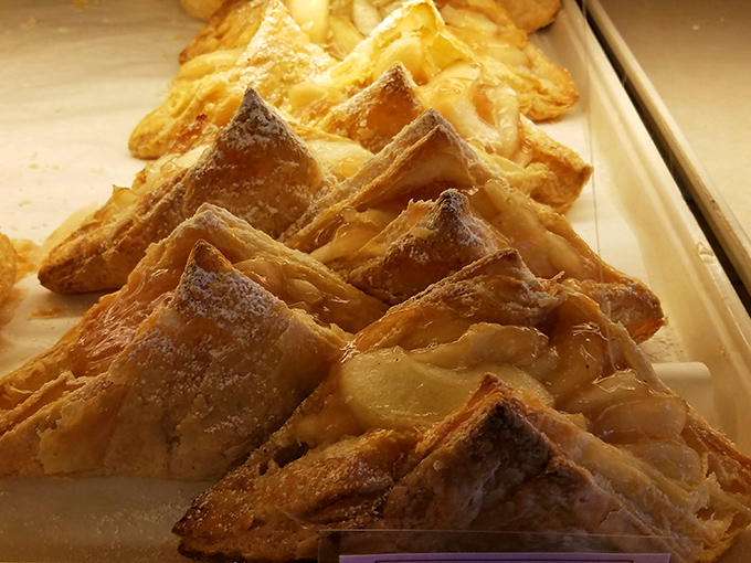 These golden apple turnovers shatter with delicate flakiness, revealing pockets of cinnamon-spiced fruit that would make grandmothers everywhere proud.