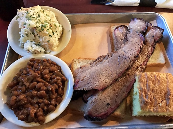 This brisket platter isn't just a meal, it's a commitment to excellence&mdash;beans and cornbread playing perfect supporting roles.