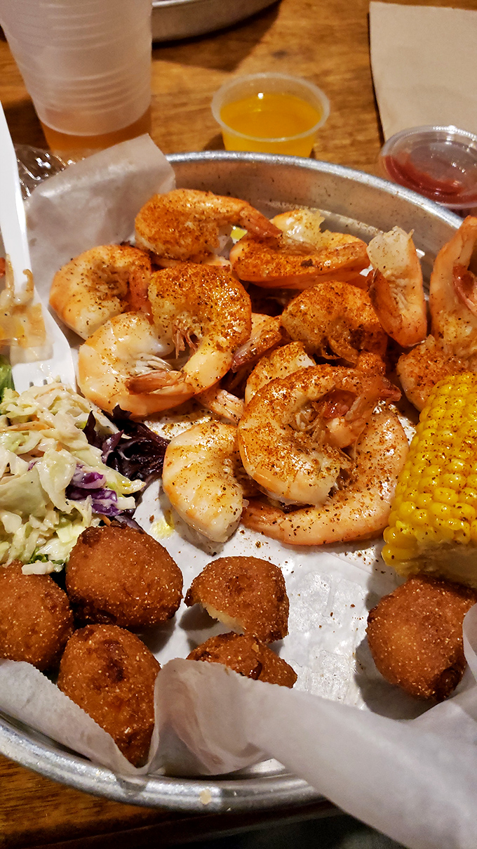 Perfectly seasoned shrimp, hushpuppies standing at attention, and coleslaw adding a crisp counterpoint. This is what vacation memories are made of.