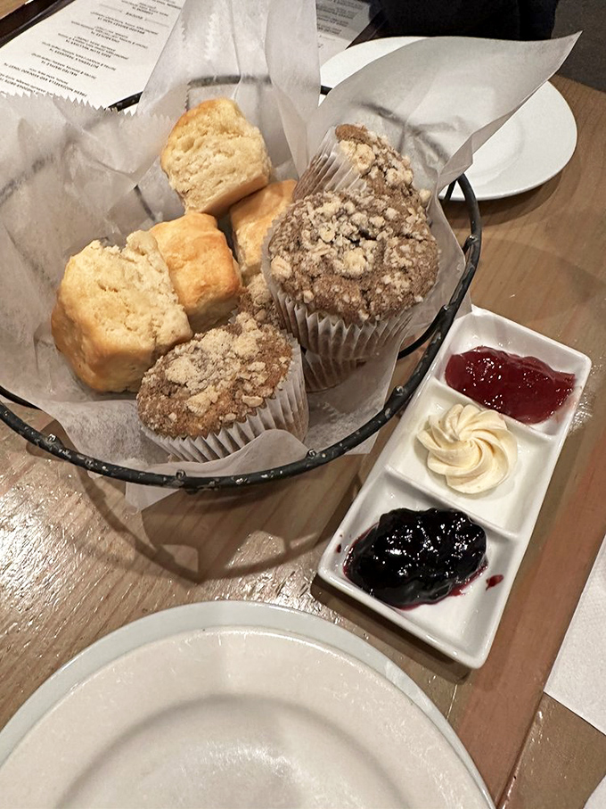 The bread basket arrives like a wicker treasure chest, with muffins and biscuits playing the roles of edible jewels.