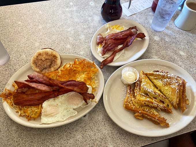 Breakfast nirvana achieved: crispy-edged eggs, perfectly crisped bacon, and French toast that would make your grandmother nod in approval.
