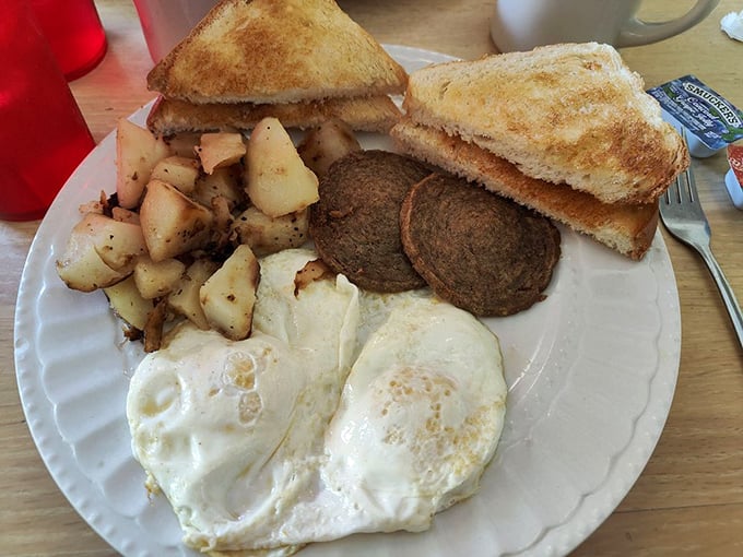 This isn't just breakfast&mdash;it's edible therapy. Home fries, eggs, and sausage patties arranged like a delicious prescription for whatever ails you.