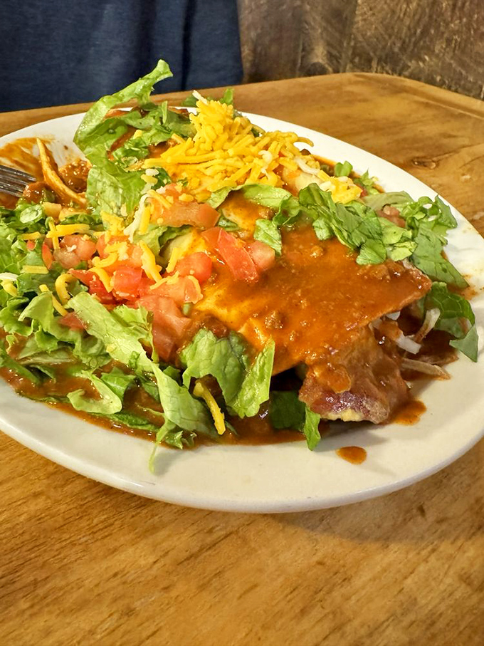 Exhibit A in the case for breakfast as the day's most important meal: hash browns surrendering beneath chile, cheese, and fresh toppings in perfect harmony.