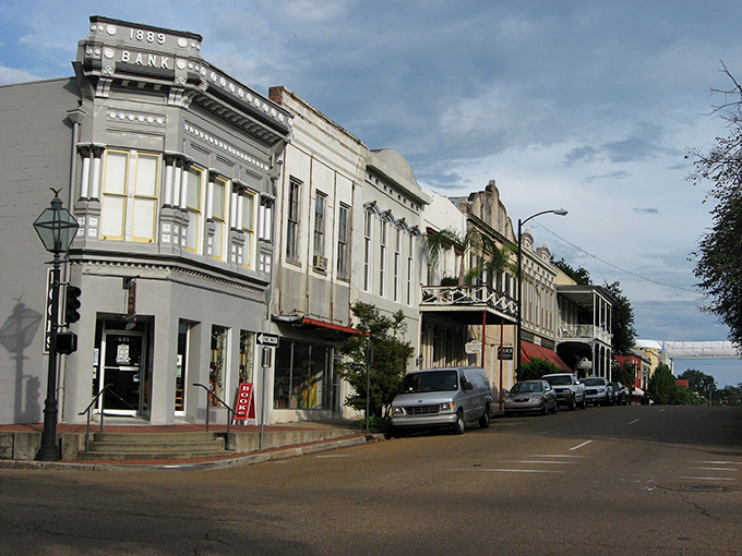 The 1889 Bank building anchors a street where architectural styles spanning two centuries create a visual timeline of American design evolution.