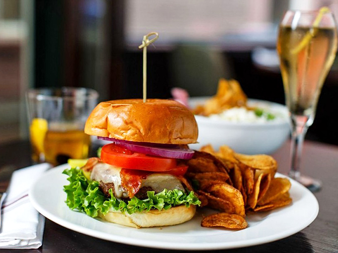 The burger arrives like a culinary superhero&mdash;cape optional, sidekick of house-made chips mandatory, and a flavor profile that deserves its own theme music.