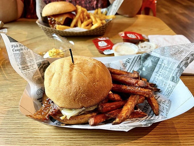 A proper burger should require both hands and several napkins. This hearty creation with sweet potato fries delivers on that sacred promise.