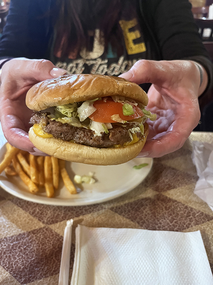 This isn't just a burger&mdash;it's architecture. The perfect stack of beef, cheese, and fresh veggies demands both admiration and immediate consumption.