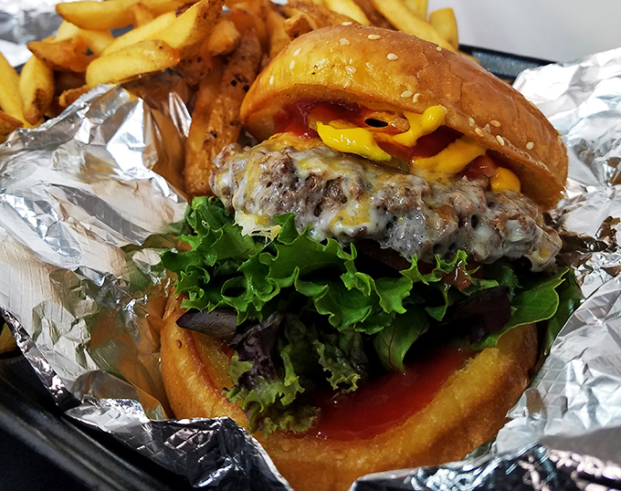 Behold the burger that makes fish jealous. That melty cheese cascade and fresh greens create the kind of sandwich worth breaking seafood loyalty for.