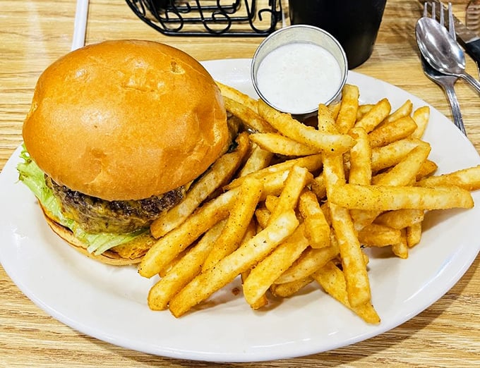 Burger perfection doesn't need fancy toppings or pretentious names. This hand-formed patty on a toasted bun speaks the universal language of satisfaction.