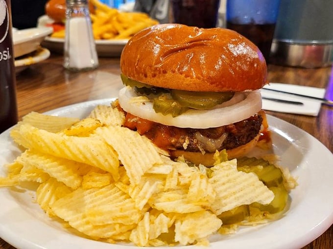 A burger that doesn't need fancy aioli or truffle oil to impress. Just honest ingredients stacked high, with chips that crunch loud enough to turn heads.