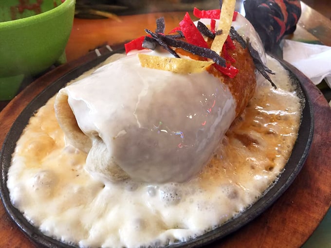 Behold the burrito in its natural habitat&mdash;surrounded by Spanish rice, refried beans, and the inevitable question: "Can I finish this?"