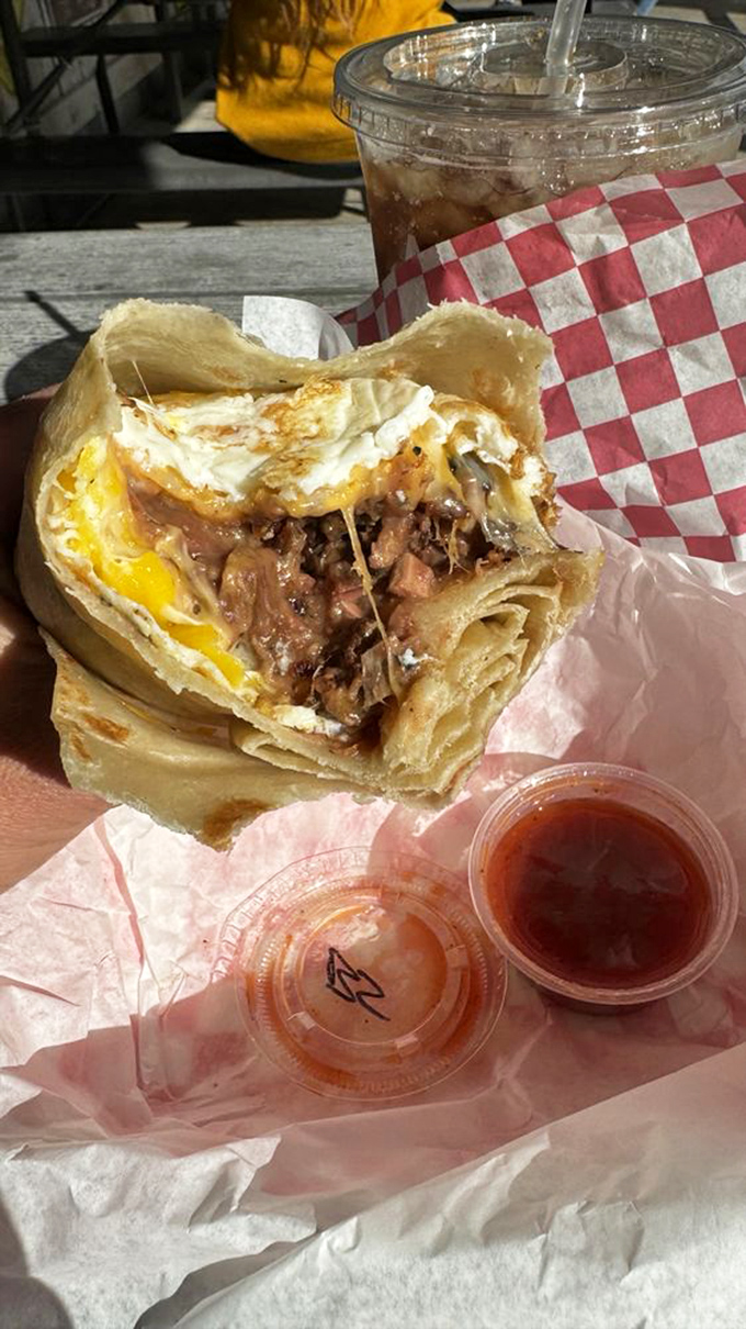 The breakfast burrito that makes morning people out of night owls—egg, meat, and cheese in perfect harmony like The Three Tenors of breakfast.