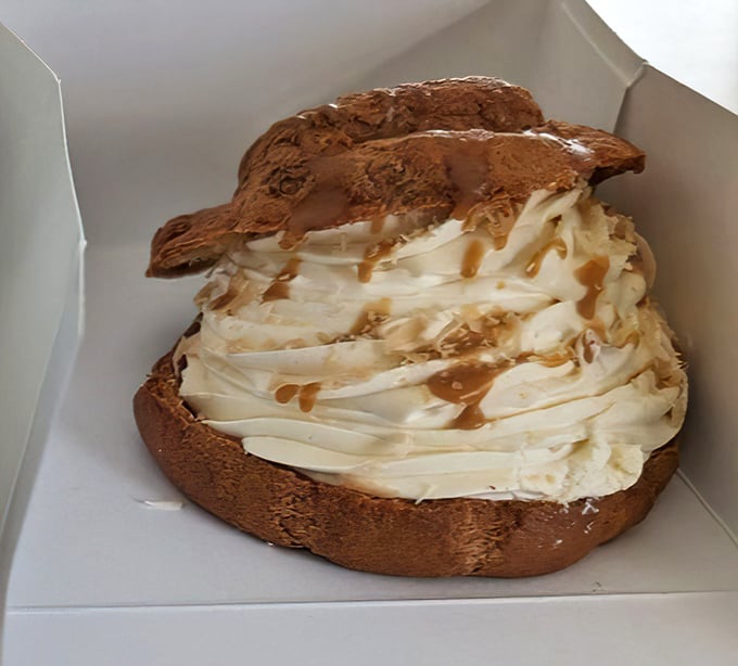 This cream puff isn't just dessert, it's architecture&mdash;a cathedral of caramel and cream that deserves its own zip code.