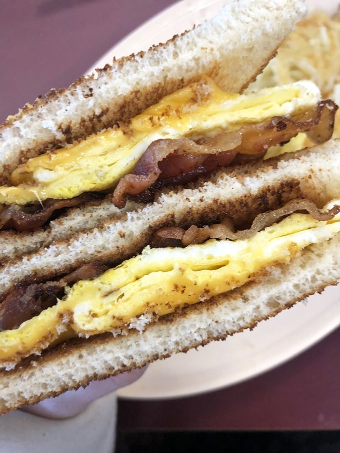 Breakfast sandwich architecture at its finest&mdash;layers of egg, bacon, and cheese creating the kind of morning motivation no alarm clock can match.