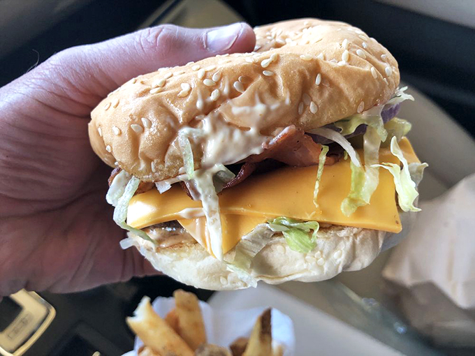 Some burgers make promises they can't keep. This beauty delivers enough cheese, fresh veggies, and juicy beef to make other sandwiches jealous.