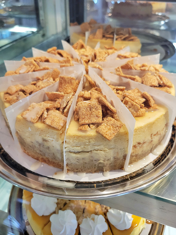 Cinnamon crunch topping creates a sweet archipelago across a sea of velvety cheesecake &ndash; no passport required for this journey.