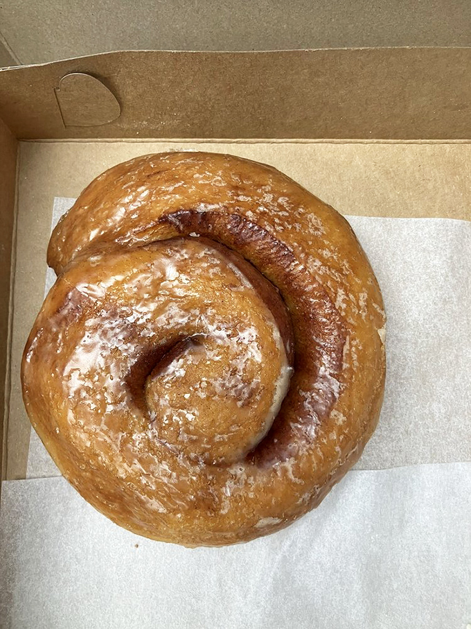 The cinnamon roll that launched a thousand road trips. Spiral-shaped perfection that makes you wonder why you'd ever settle for anything less.