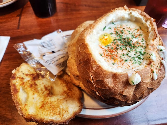 Behold the bread bowl in all its glory! That sourdough fortress holding creamy chowder is engineering and gastronomy in perfect harmony.