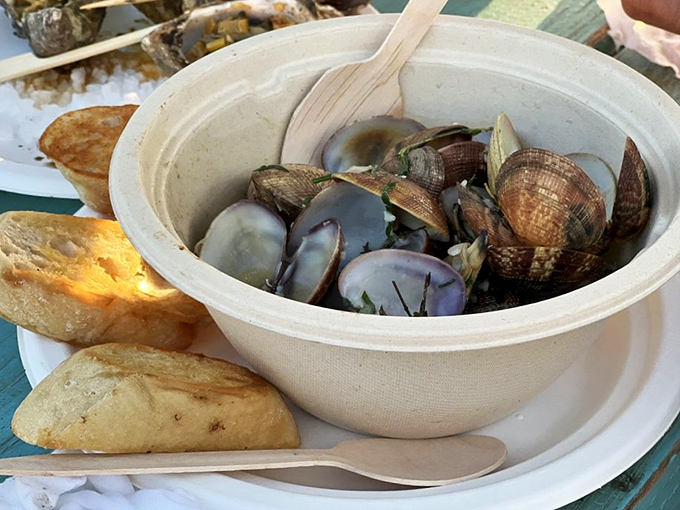 Littleneck clams swimming in herby broth with crusty bread standing by. The kind of simple perfection that makes you question complicated cooking.