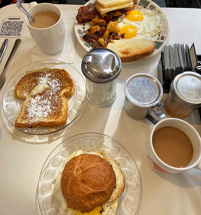 Breakfast geometry at its finest&mdash;triangles of perfectly golden toast flanking twin sunny-side-up eggs while home fries stand guard. Morning mathematics never tasted so good.