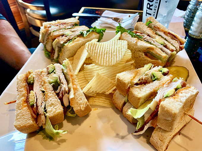 The club sandwich: three layers of bread architecture holding the perfect ratio of turkey, bacon, and veggies. Skyscrapers should be this well-constructed.