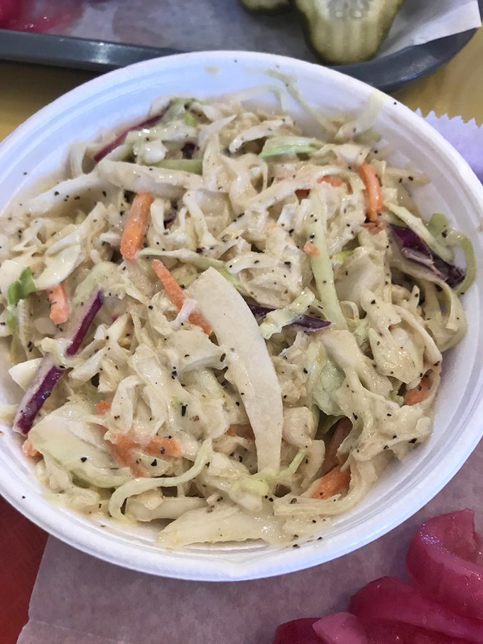 Cole slaw that knows its role: not just a side dish, but a cooling counterpoint to barbecue's rich intensity. Crunchy, creamy perfection.