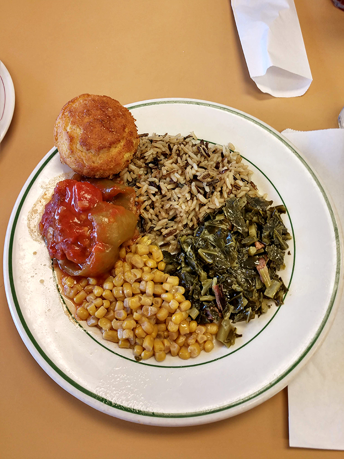A Southern symphony on a plate &ndash; where collard greens, wild rice, and stuffed bell pepper perform a three-part harmony of comfort.