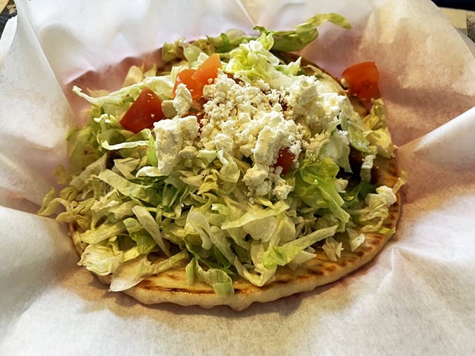 Fresh pita cradling crisp lettuce and feta &ndash; this gyro isn't just a meal, it's a Mediterranean vacation for your mouth, no passport required.