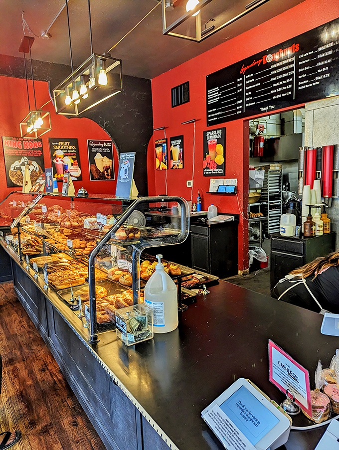 The counter at Legendary Doughnuts: where dreams are served with a side of coffee and willpower goes to surrender.