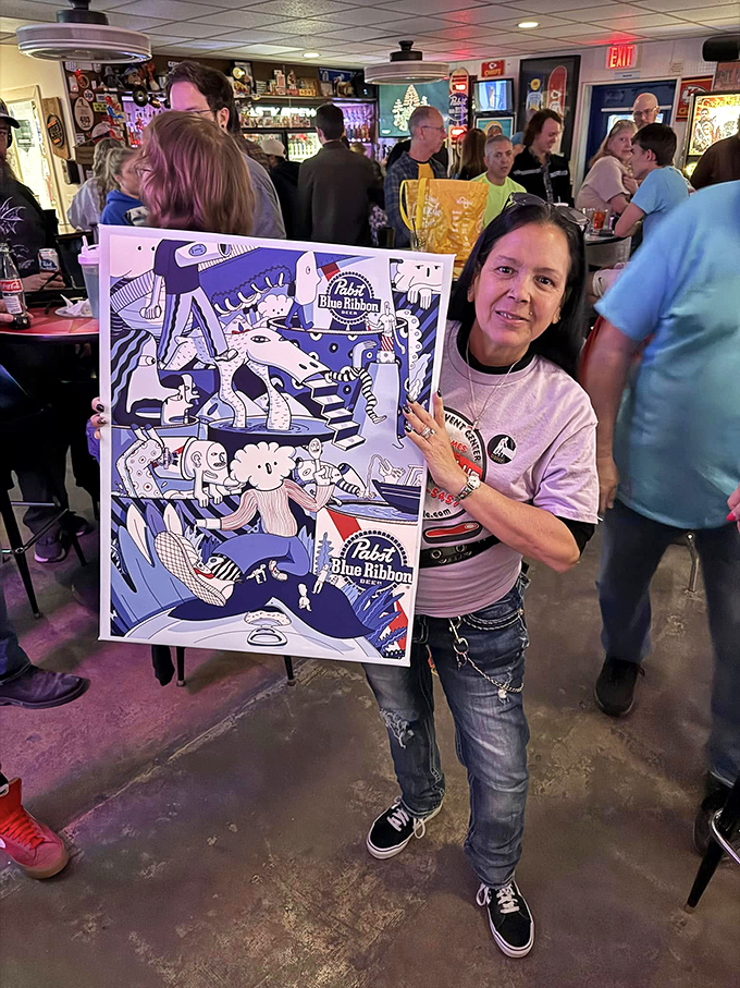 Victory tastes sweeter when it comes with artwork. This patron's prize is a colorful reminder of nights spent among friends and flippers.