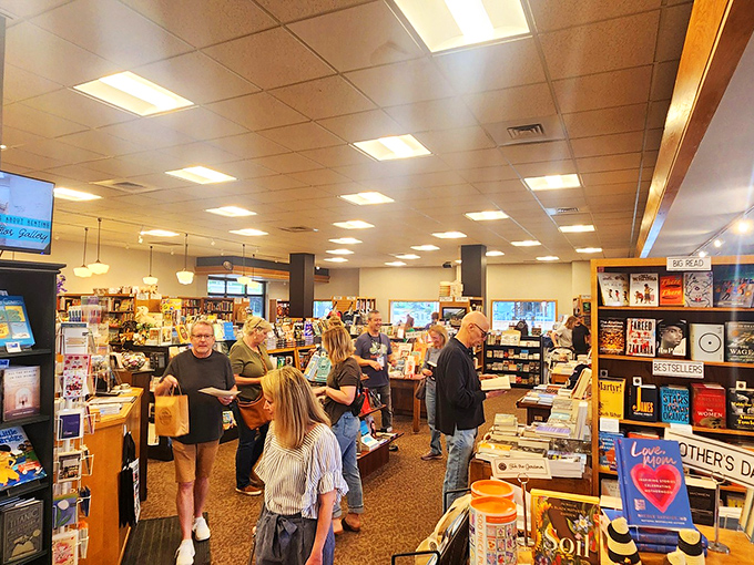 Literary pilgrims gather at the altar of new releases. Notice how they move with reverence, as if in the presence of something holy.